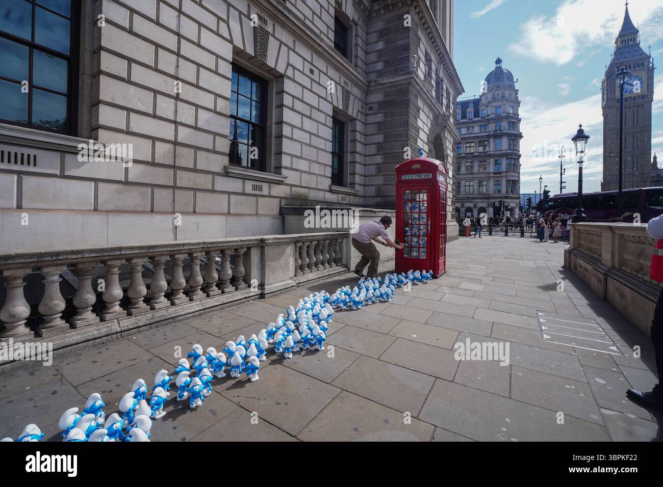 London, UK 9 July 2025. A trail of Smurfs spill put from a red phone ...