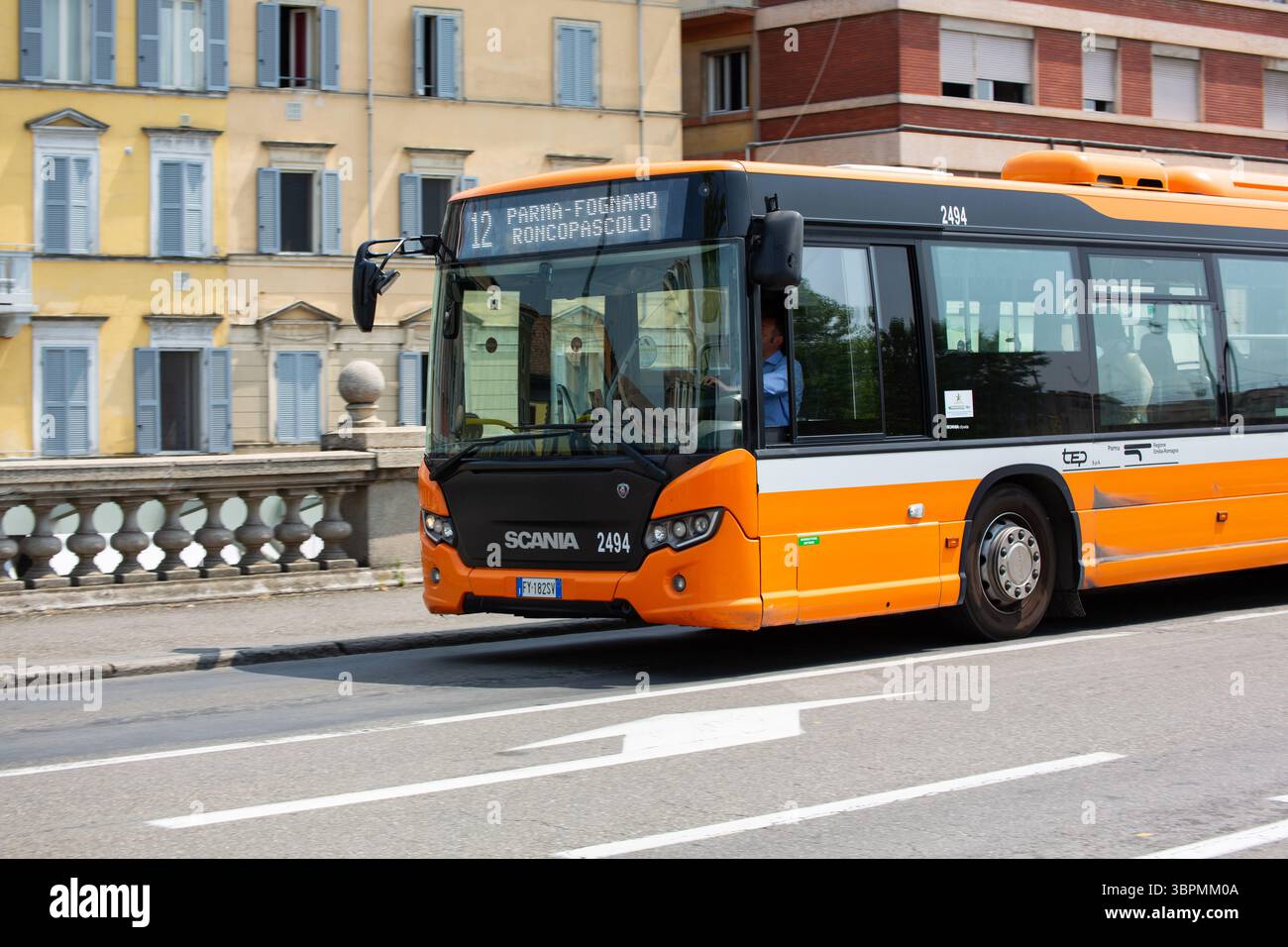 City bus driving through European town showcasing local transportation ...