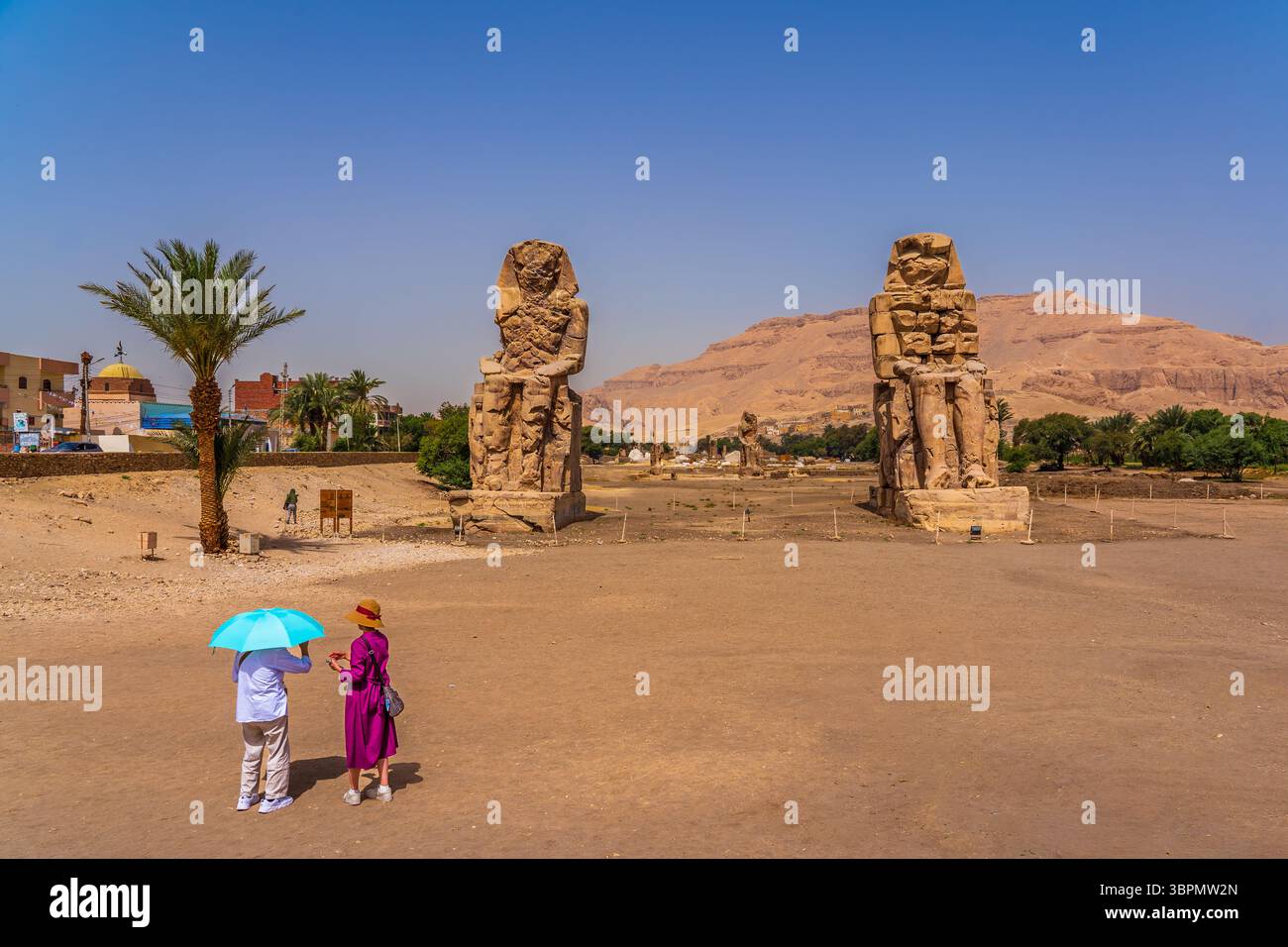 Colossi of Memnon, temple complex of Amenhotep III - Luxor Stock Photo ...