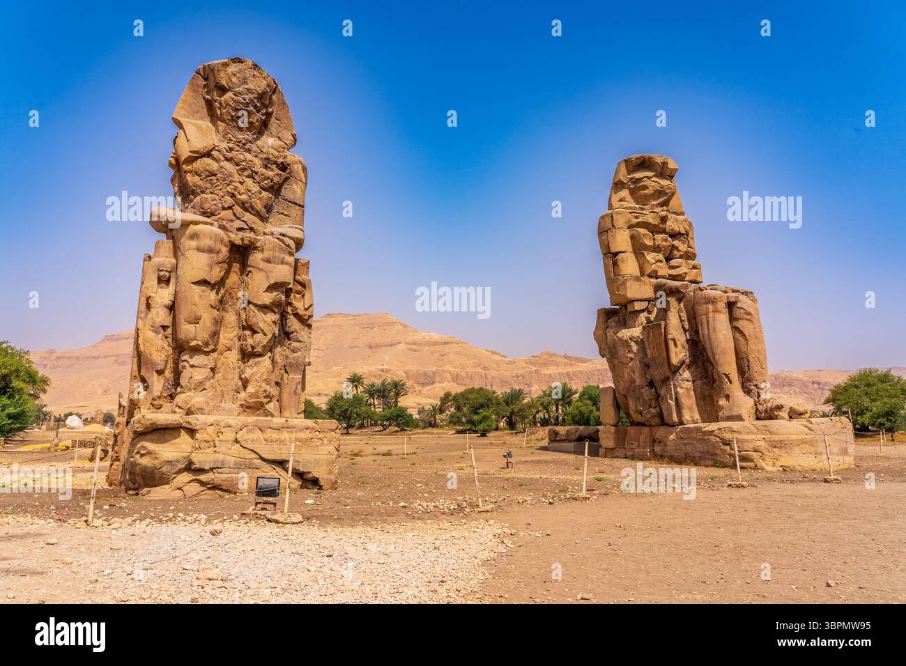 Colossi of Memnon, temple complex of Amenhotep III - Luxor Stock Photo ...