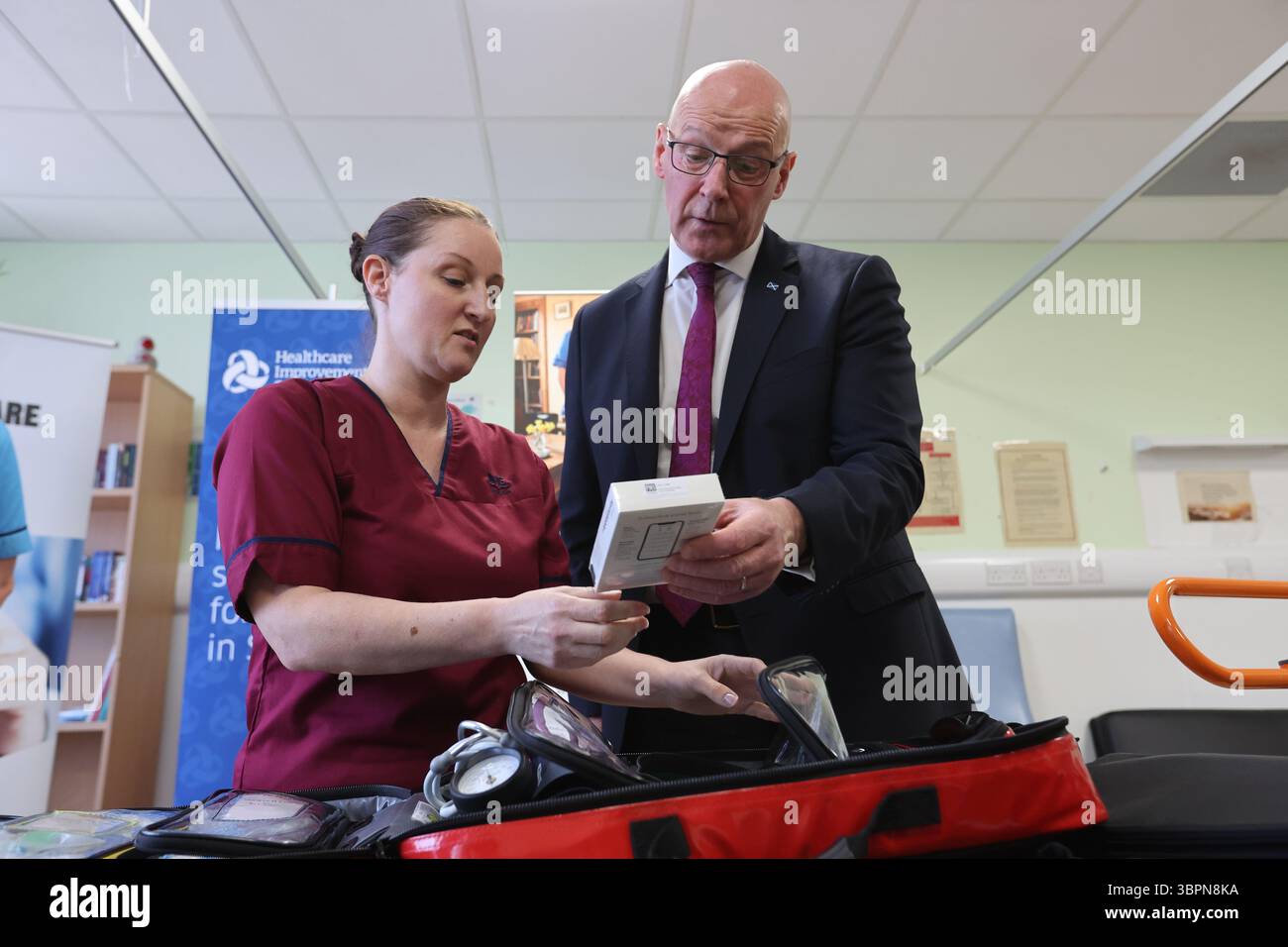 First Minister John Swinney medical staff Louise Kirkby, during a visit ...