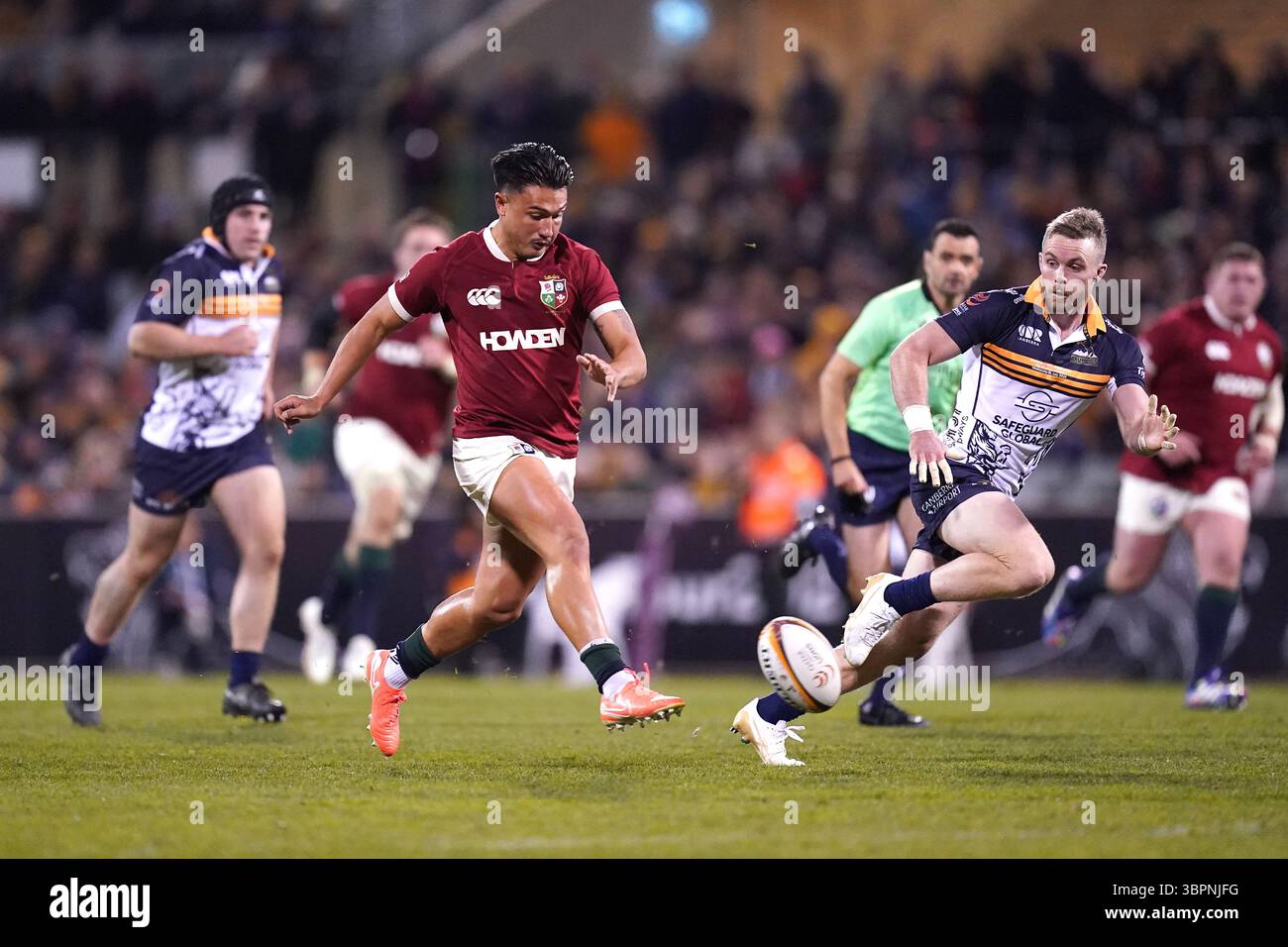 The British & Irish Lions' Marcus Smith kicks the ball forward during ...