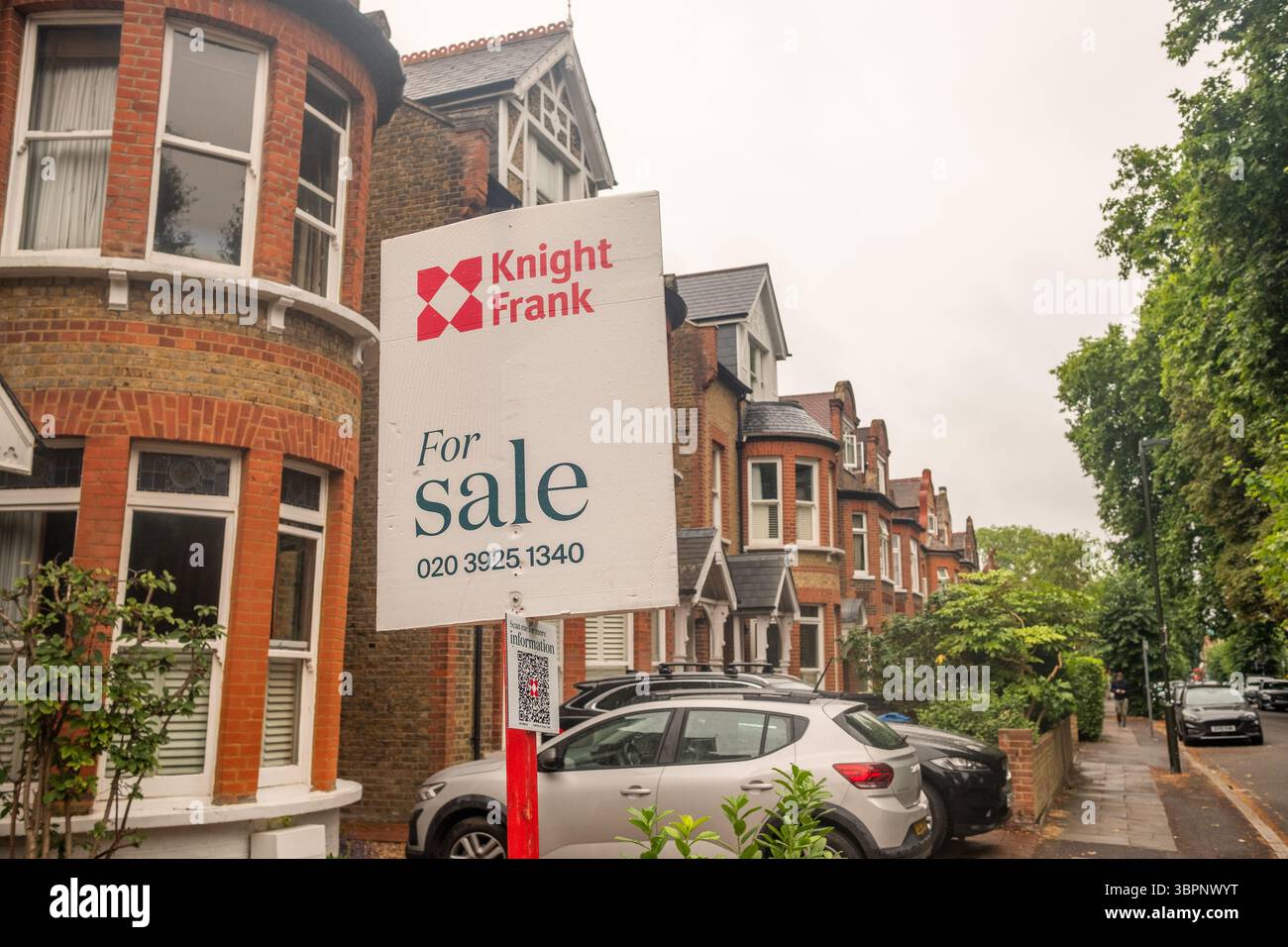 LONDON- JULY 2, 2025: Estate Agent For Sale sign on street of London suburban houses in south ...
