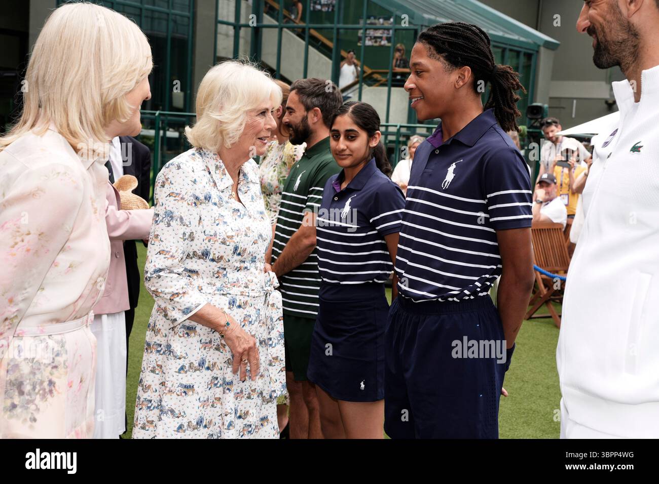 Queen Camilla speaks with ball boy Karsten at the All England Lawn ...