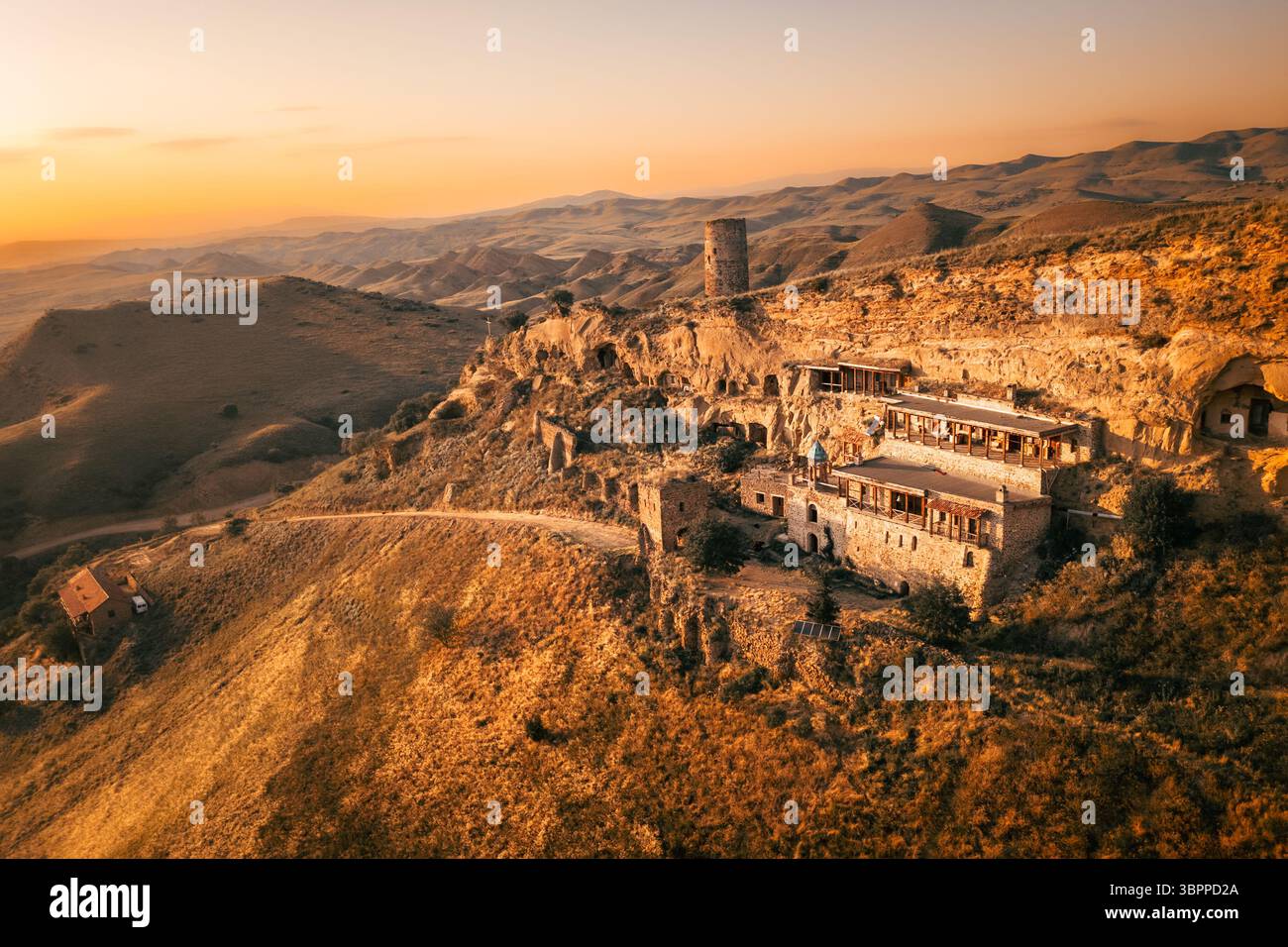 Aerial view of an ancient Orthodox monastery carved into remote cliffs ...