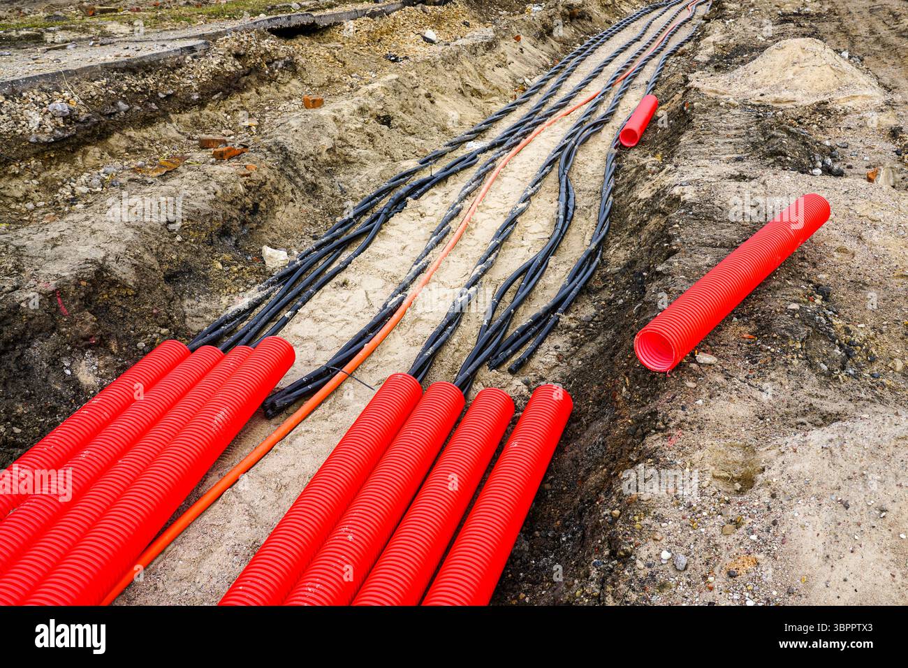 Underground Power Cable Installation with Protective Red Conduits in ...