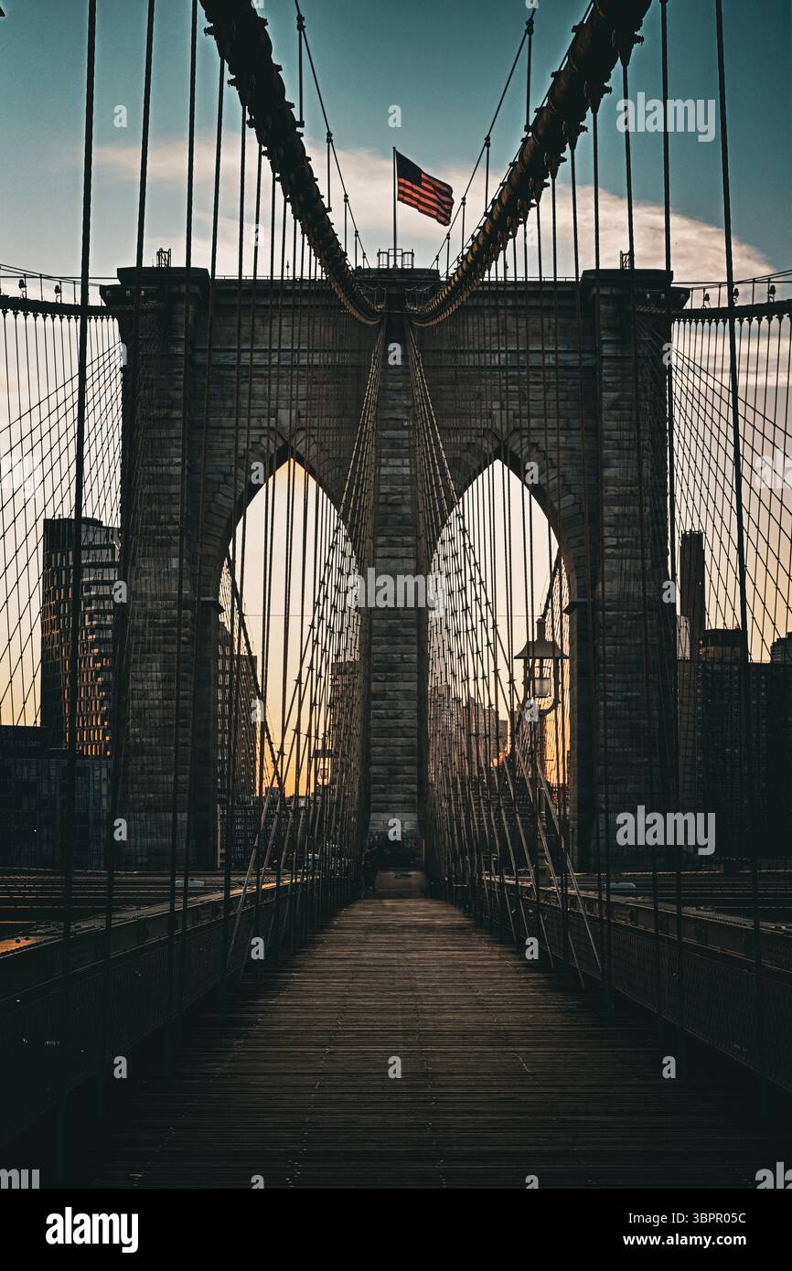 Sunset view of the Brooklyn Bridge pedestrian walkway with its iconic ...