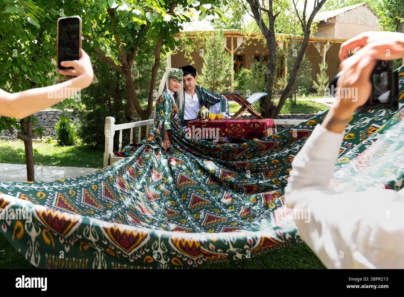 Samarkand, Uzbekistan - May 28, 2025: Young Uzbek couple in traditional ...