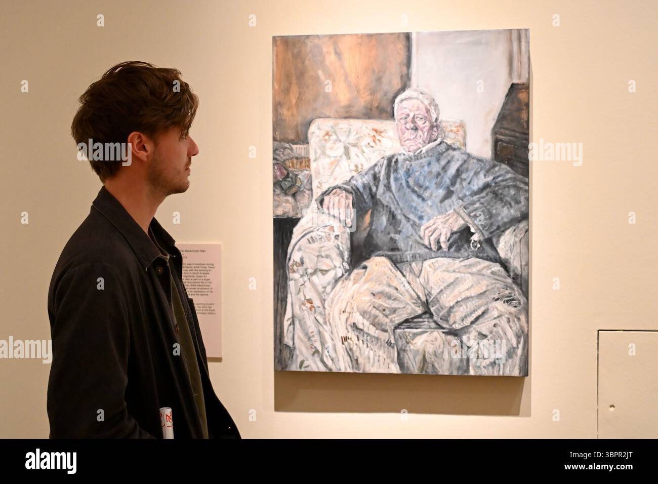 London, UK. Artist Finlay Trevor with his portrait "Quest for the ...