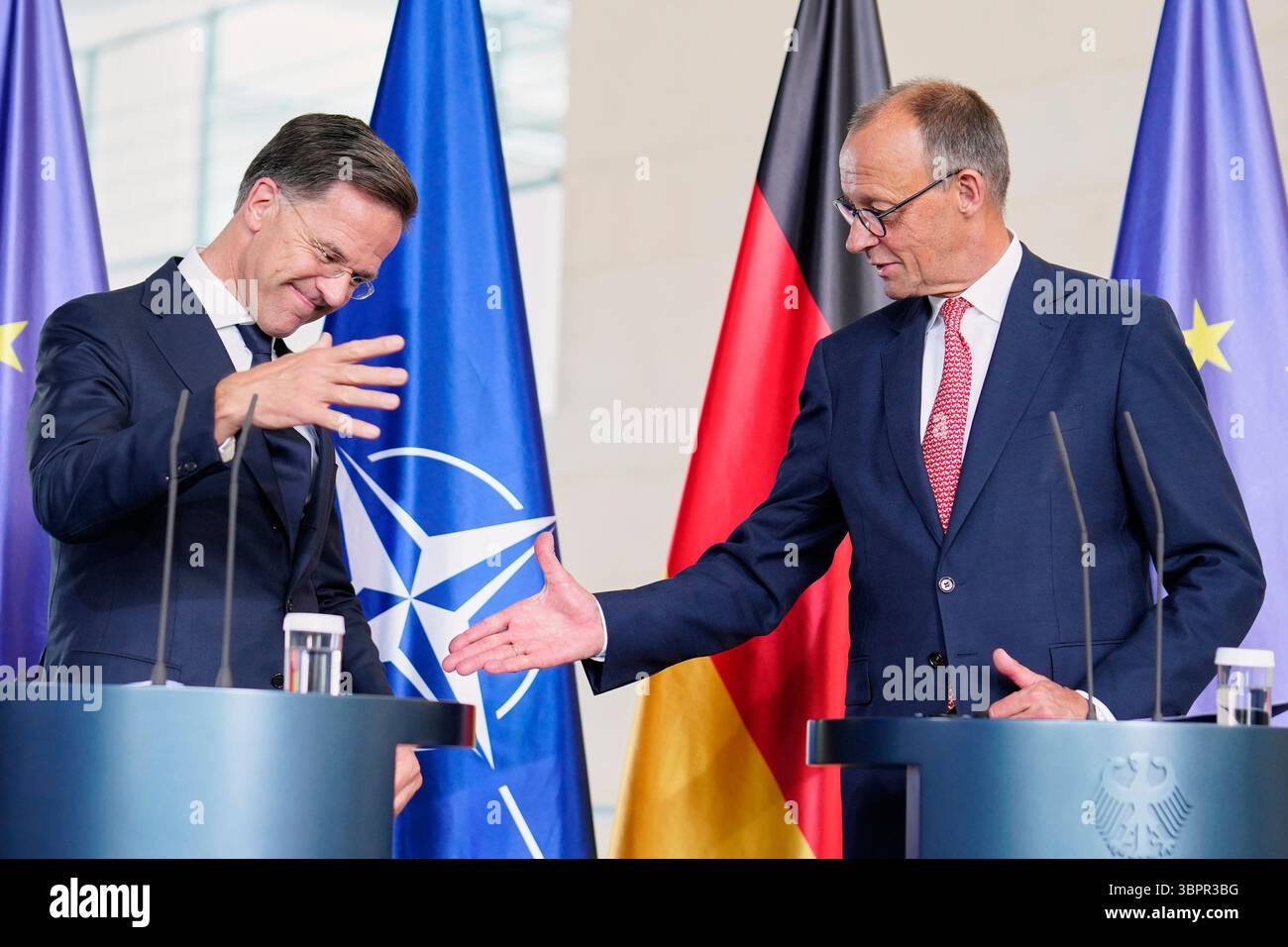 German Chancellor Friedrich Merz, right, and NATO Secretary General ...