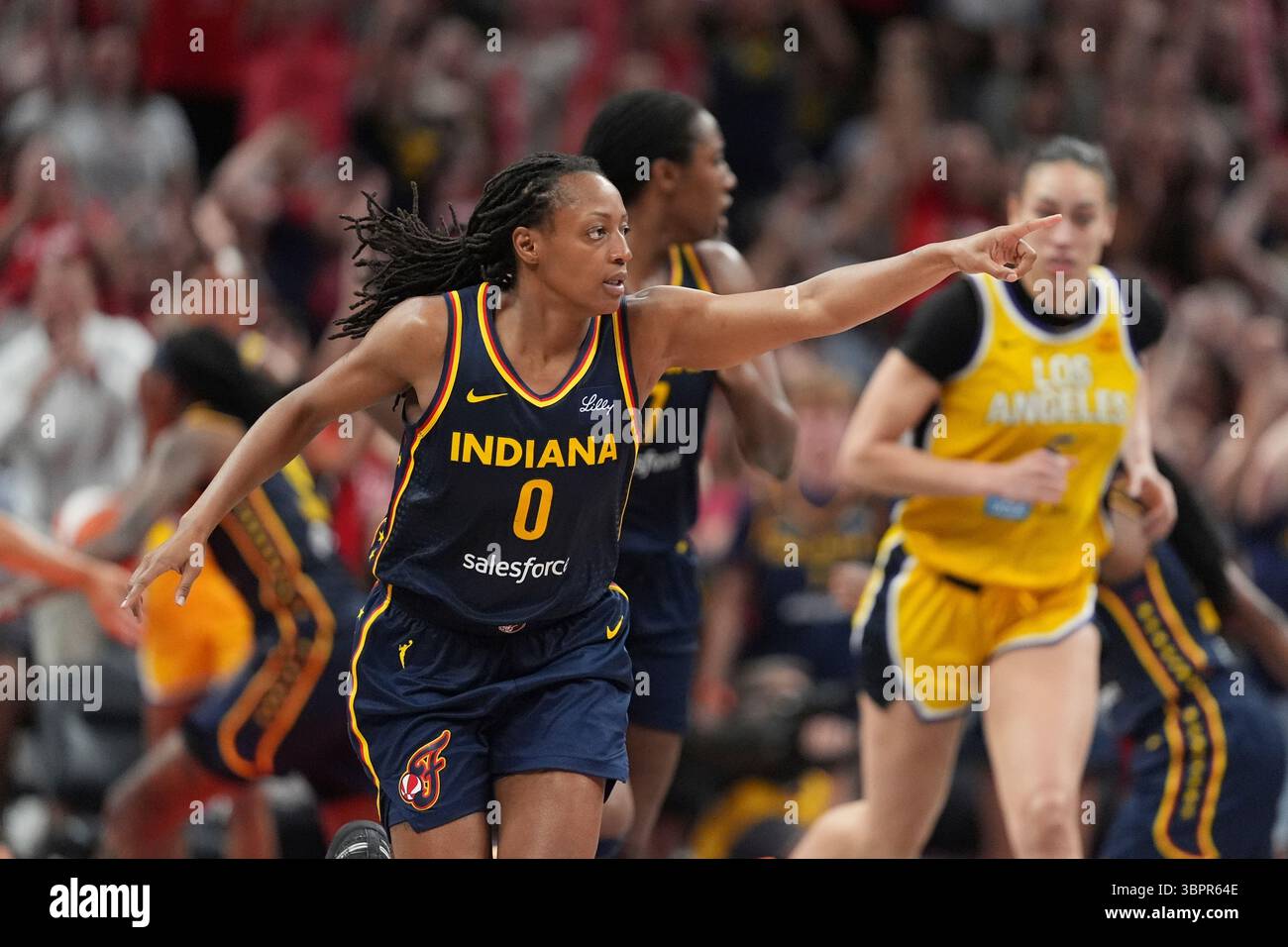 Indiana Fever's Kelsey Mitchell reacts after hitting a 3-point shot ...