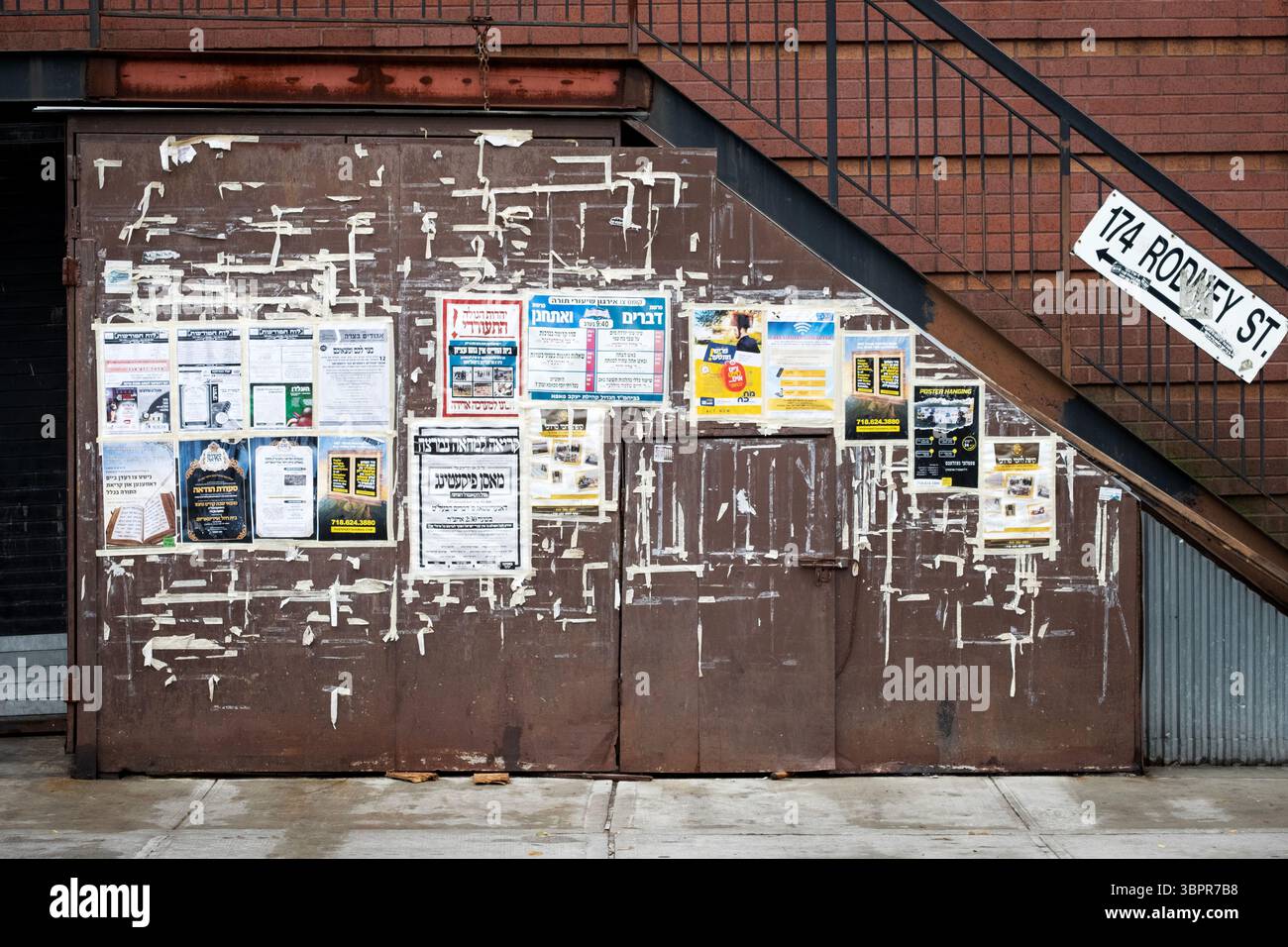 URBAN LANDSCAPE - A wall of adverts & notices that are primarily in ...