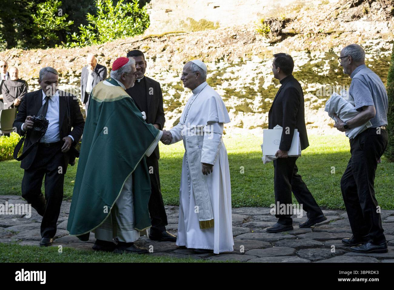 Pope Leo XIV greets Cardinal Fabio Baggio upon his arrival to celebrate ...