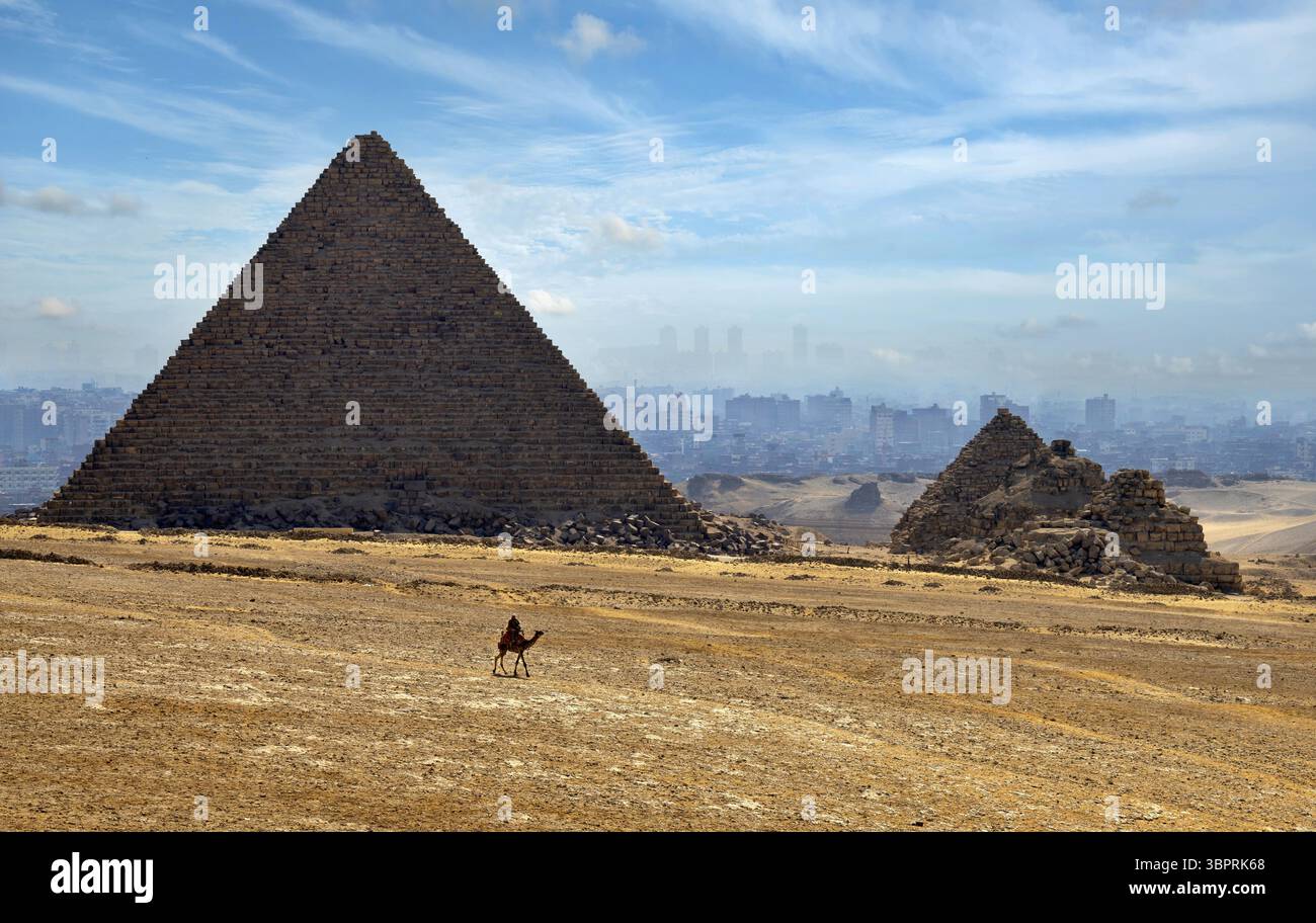 Pyramid of Menkaure (left) and Pyramids of Queens in Egypt Stock Photo ...