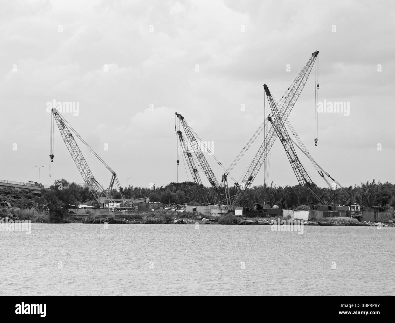 Saigon river with port infrastructure in Ho Chi Minh City, Vietnam ...