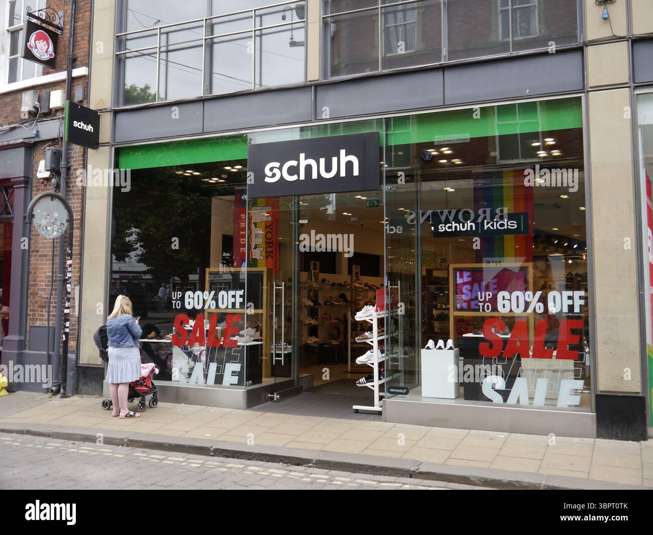 Schuh Shoe shop Corporate logo signs in York City centre in June 2025 ...
