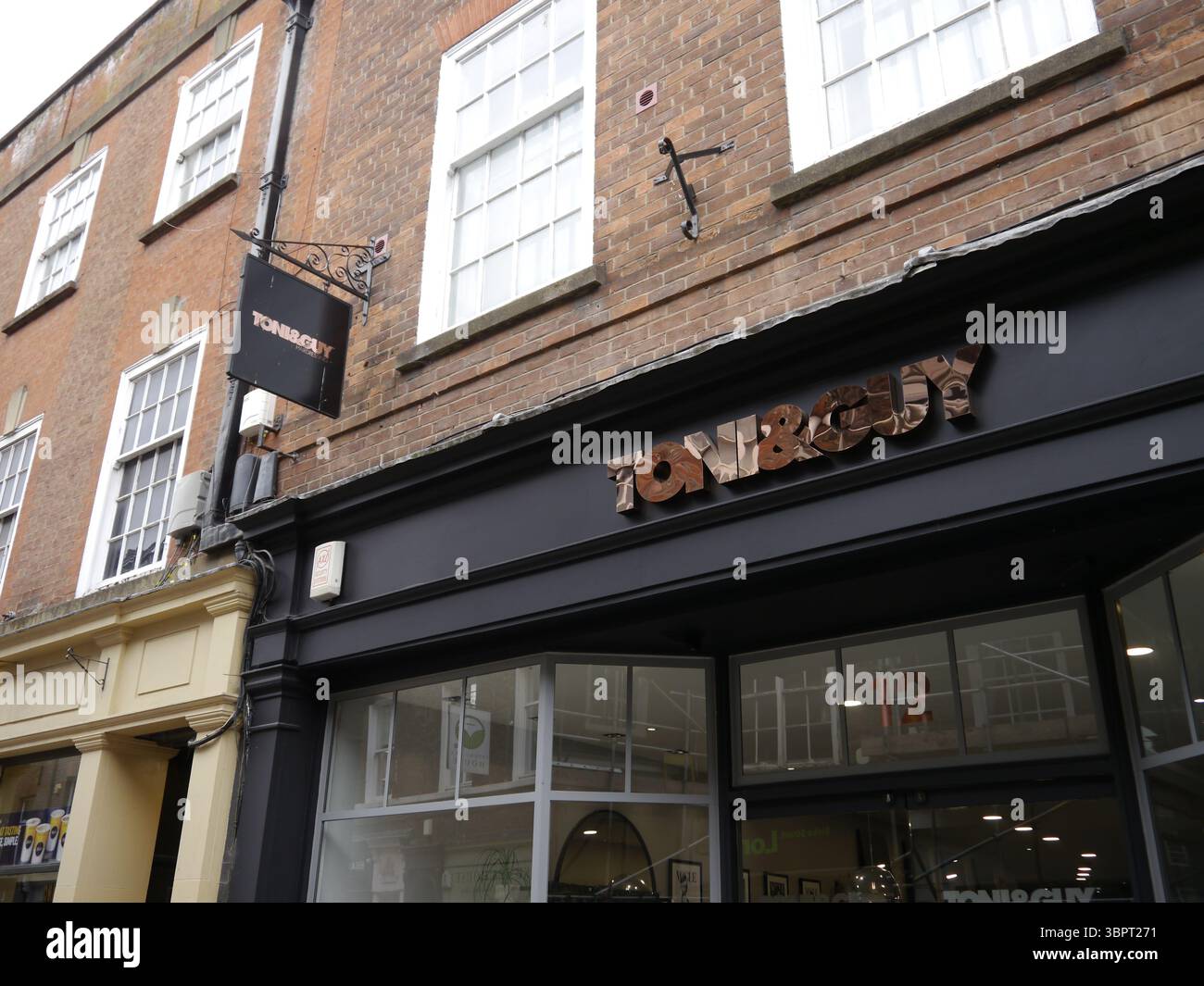 Toni and Guy hairdressers Corporate logo signs in York City centre in ...