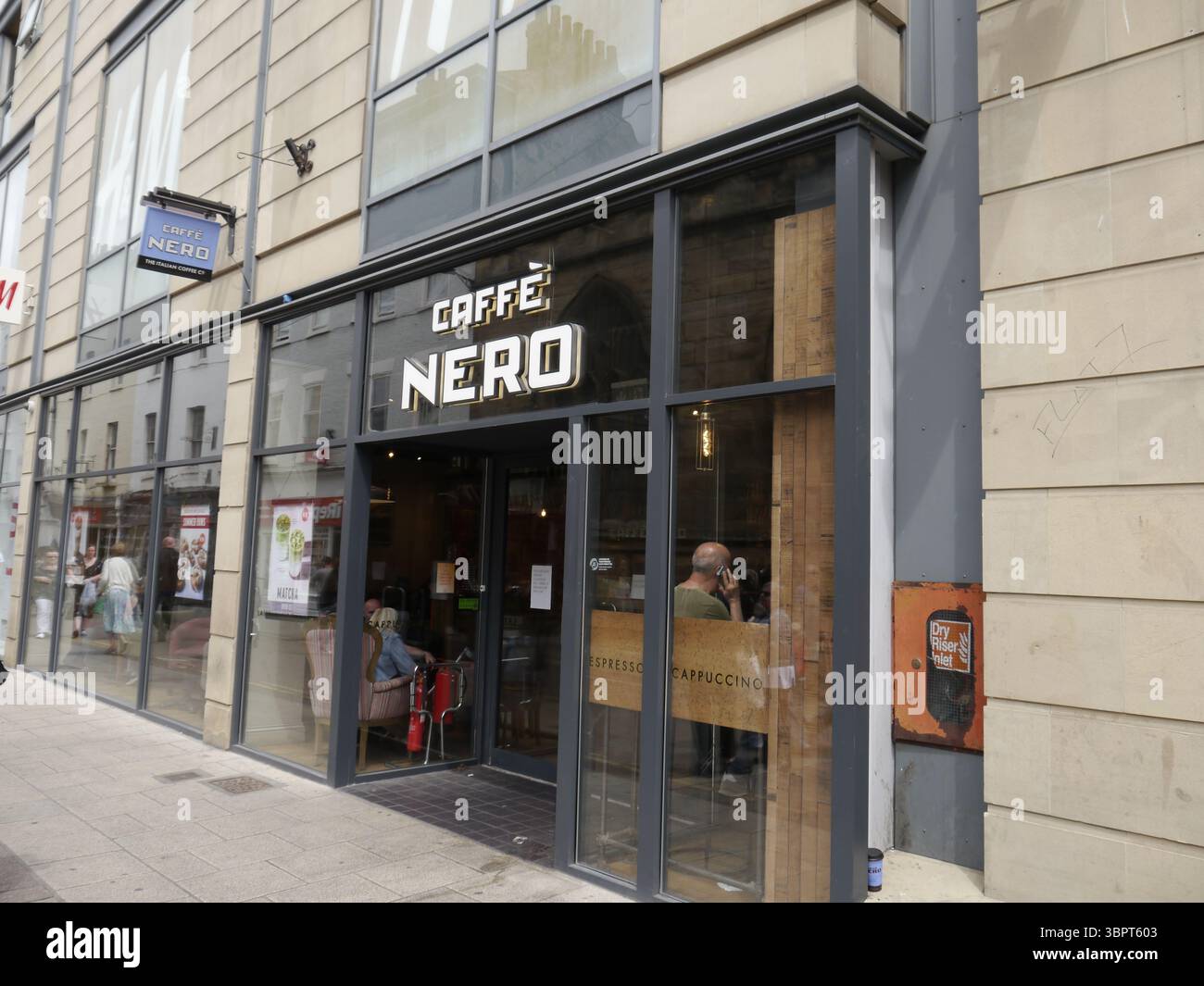 café Nero coffee shop cafe Corporate logo signs in York City centre in ...