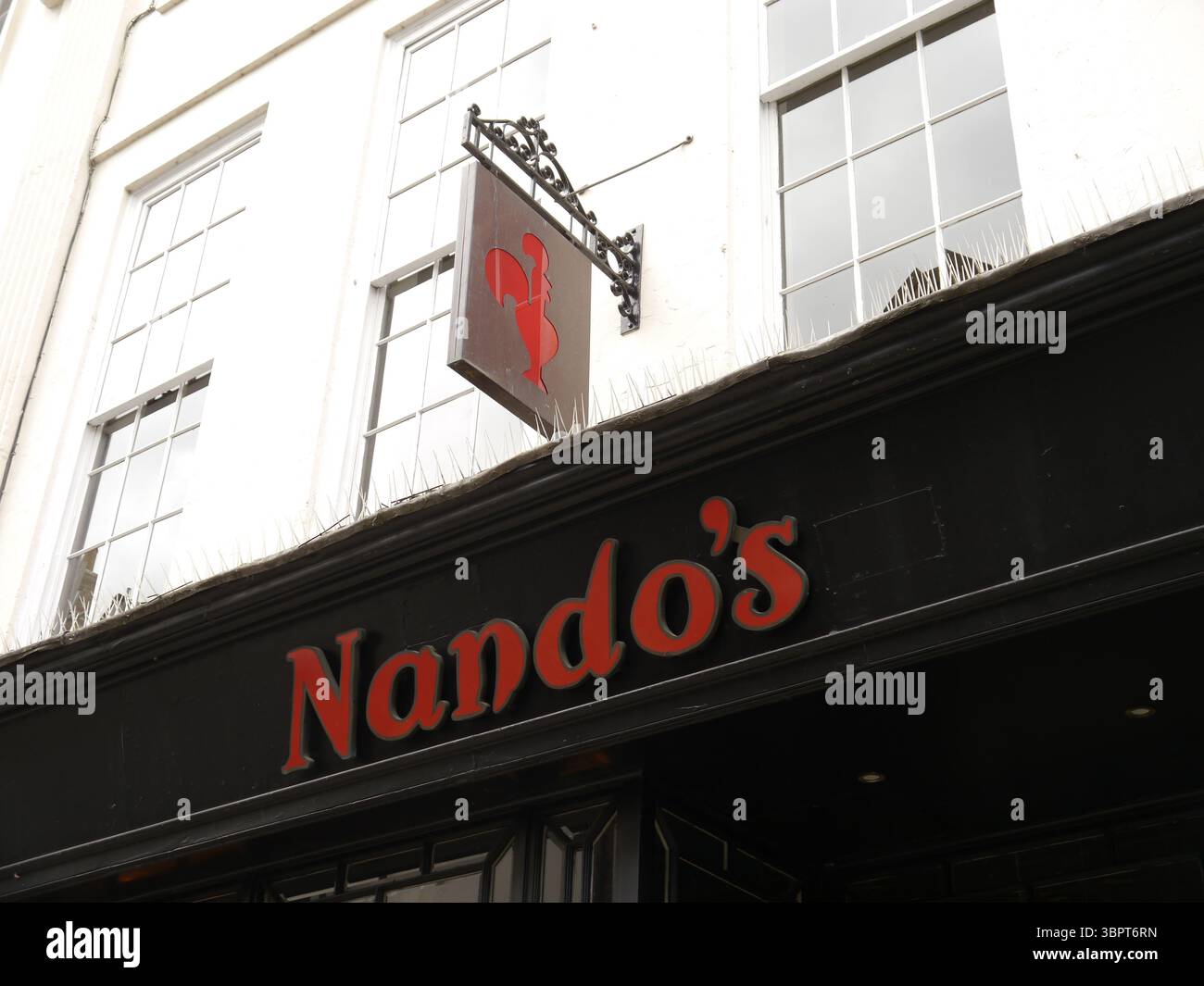 Nando’s, chicken Corporate logo signs in York City centre in June 2025 ...