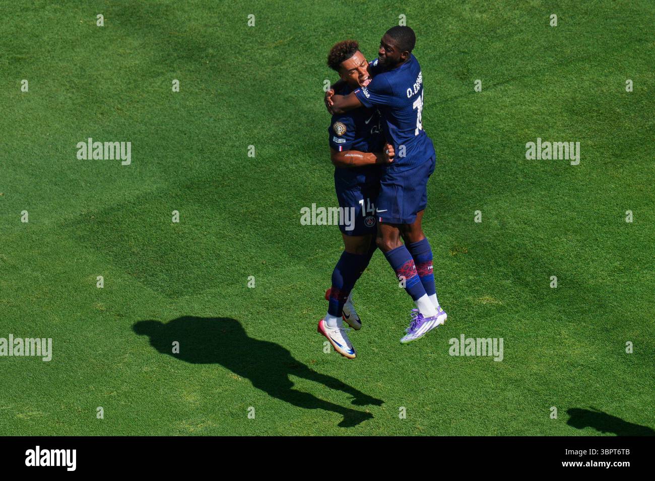 Paris Saint-Germain's Desire Doue, left, and Ousmane Dembele, right ...