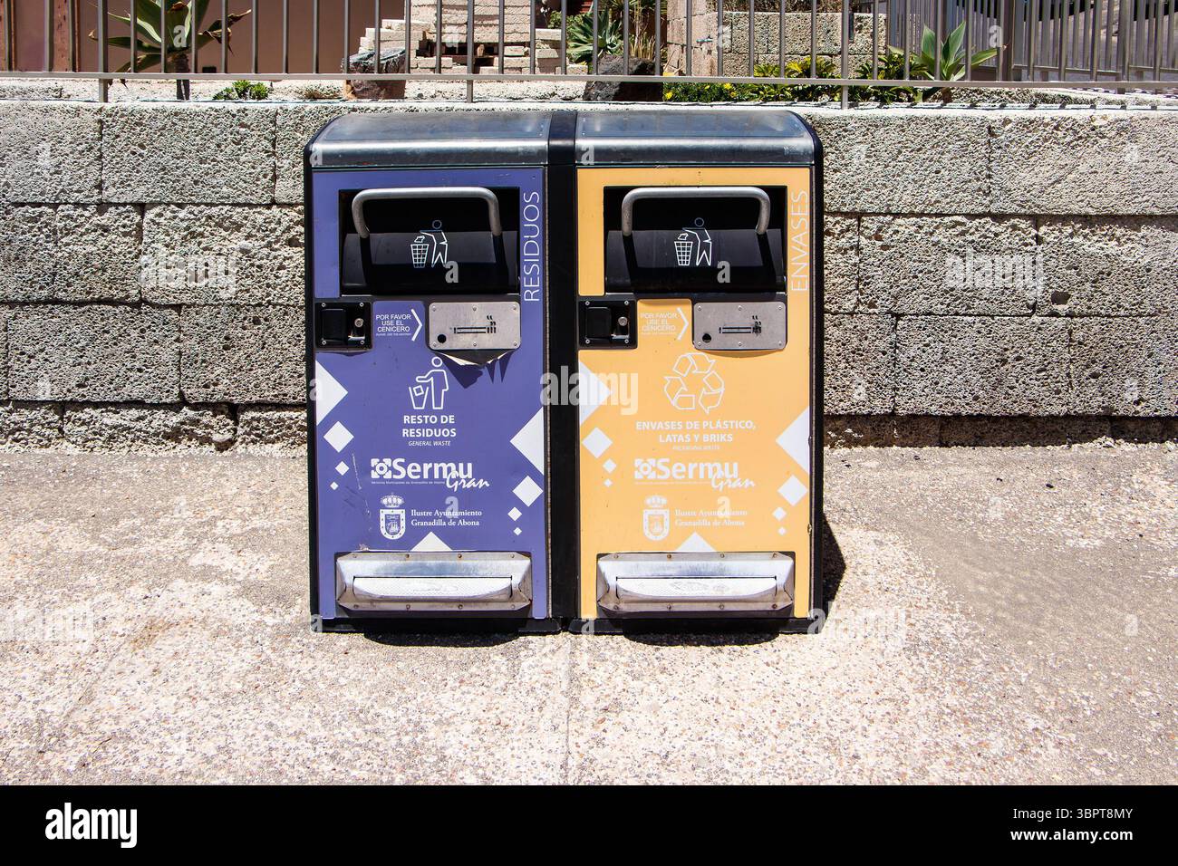 Dual waste recycling bins for landfill and recyclables positioned ...