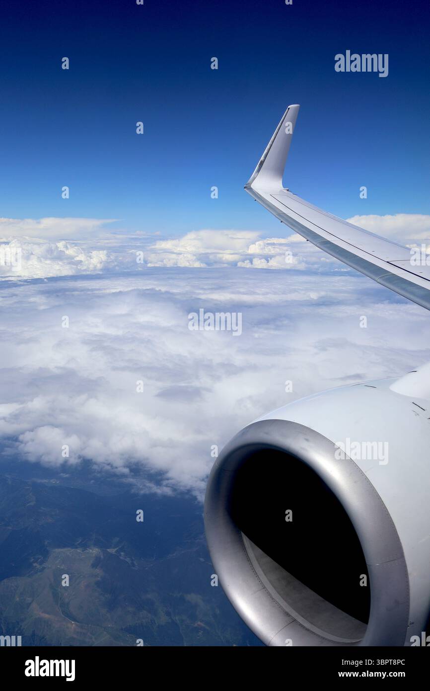 Airplane Wing and Engine View Above the Clouds From a Window Seat ...