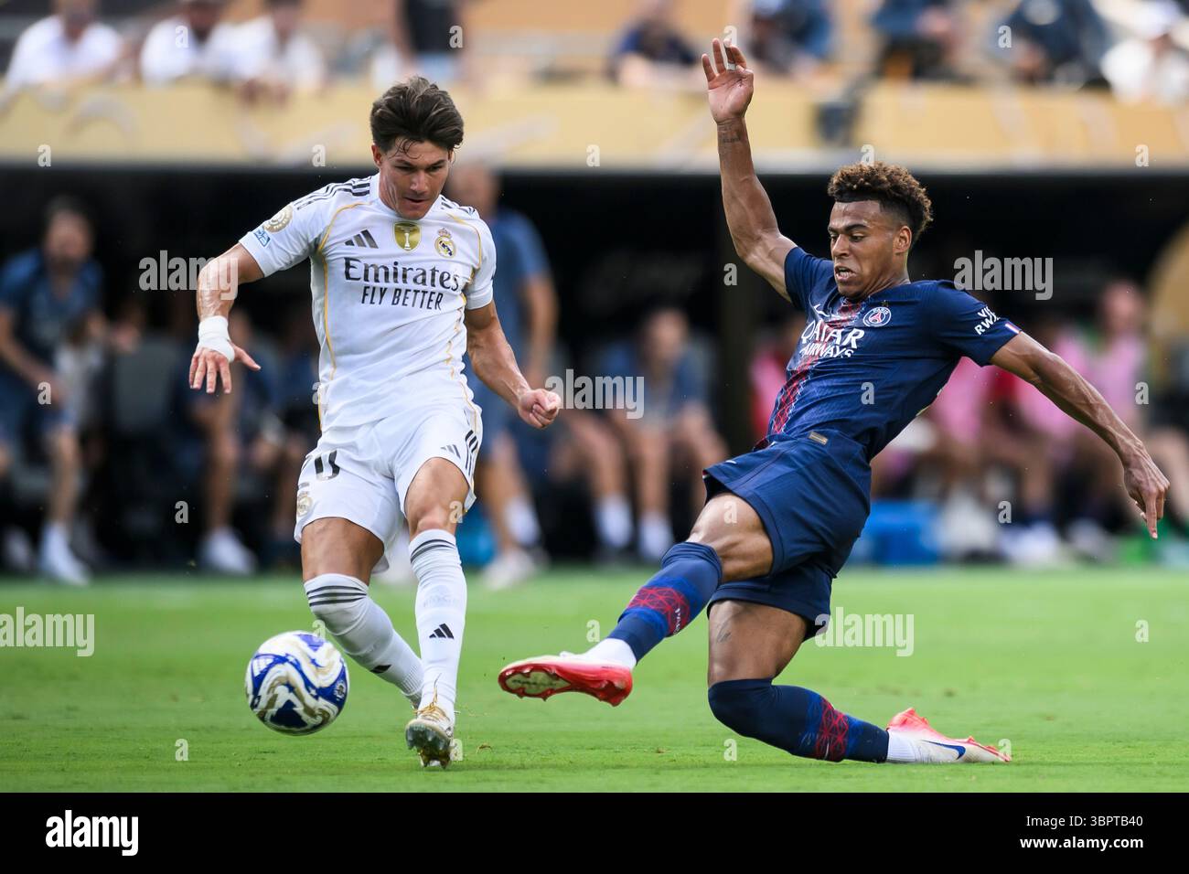 Fran Garcia of Real Madrid CF competes for the ball with Desire Doue of ...