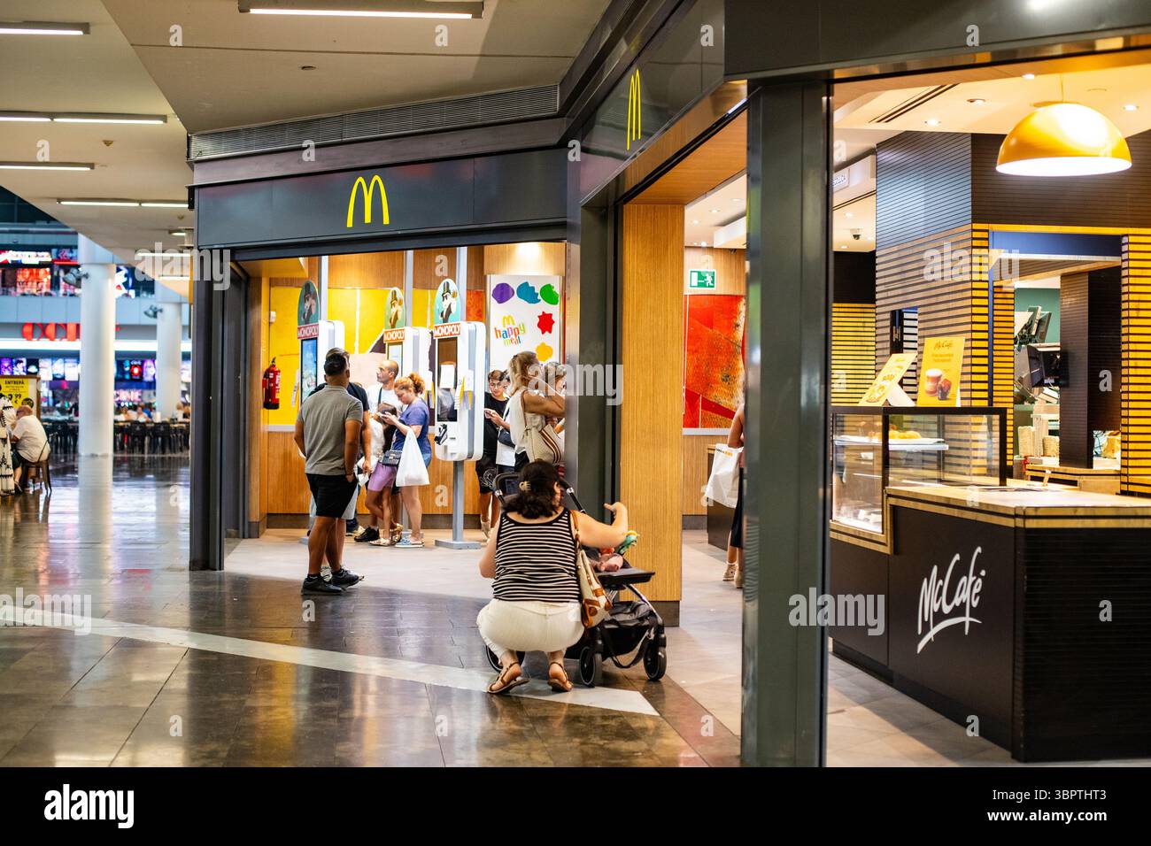 Contemporary McCafé Setup and McDonald's Entrance, Bustling Restaurant ...