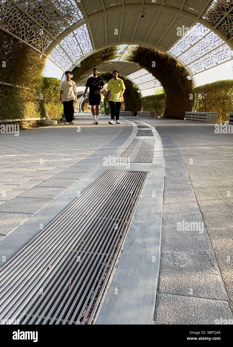 SUMMER IN QATAR People walk through the world s longest air-conditioned ...