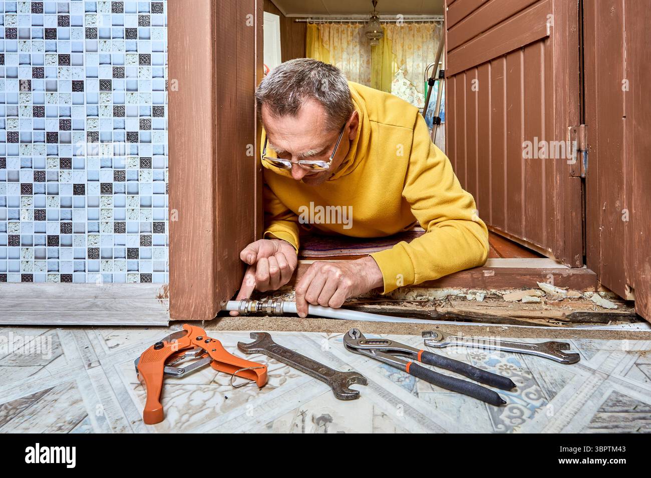 Plumber aligns stub of compression coupling inside composite tubing to ...