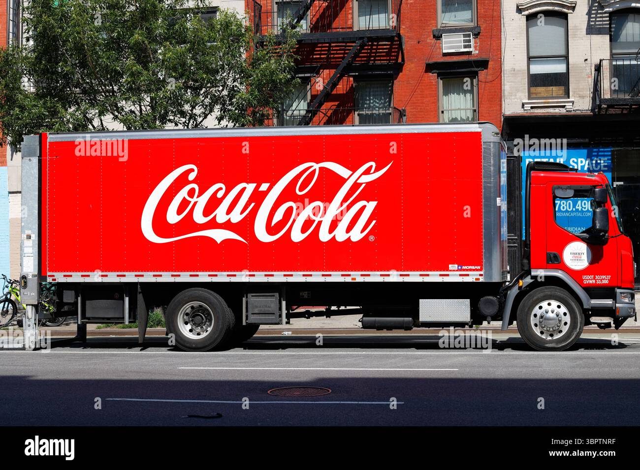 A red delivery truck with the Coca Cola logo in New York City Stock ...
