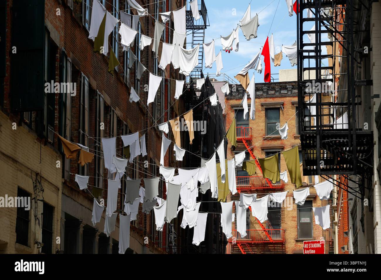Undergarments hang outside a former sweatshop, or garment factory, on ...