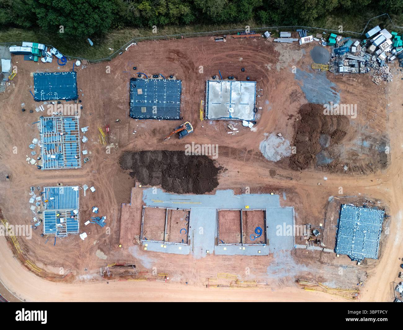 Aerial view of a construction site showing building foundations at ...
