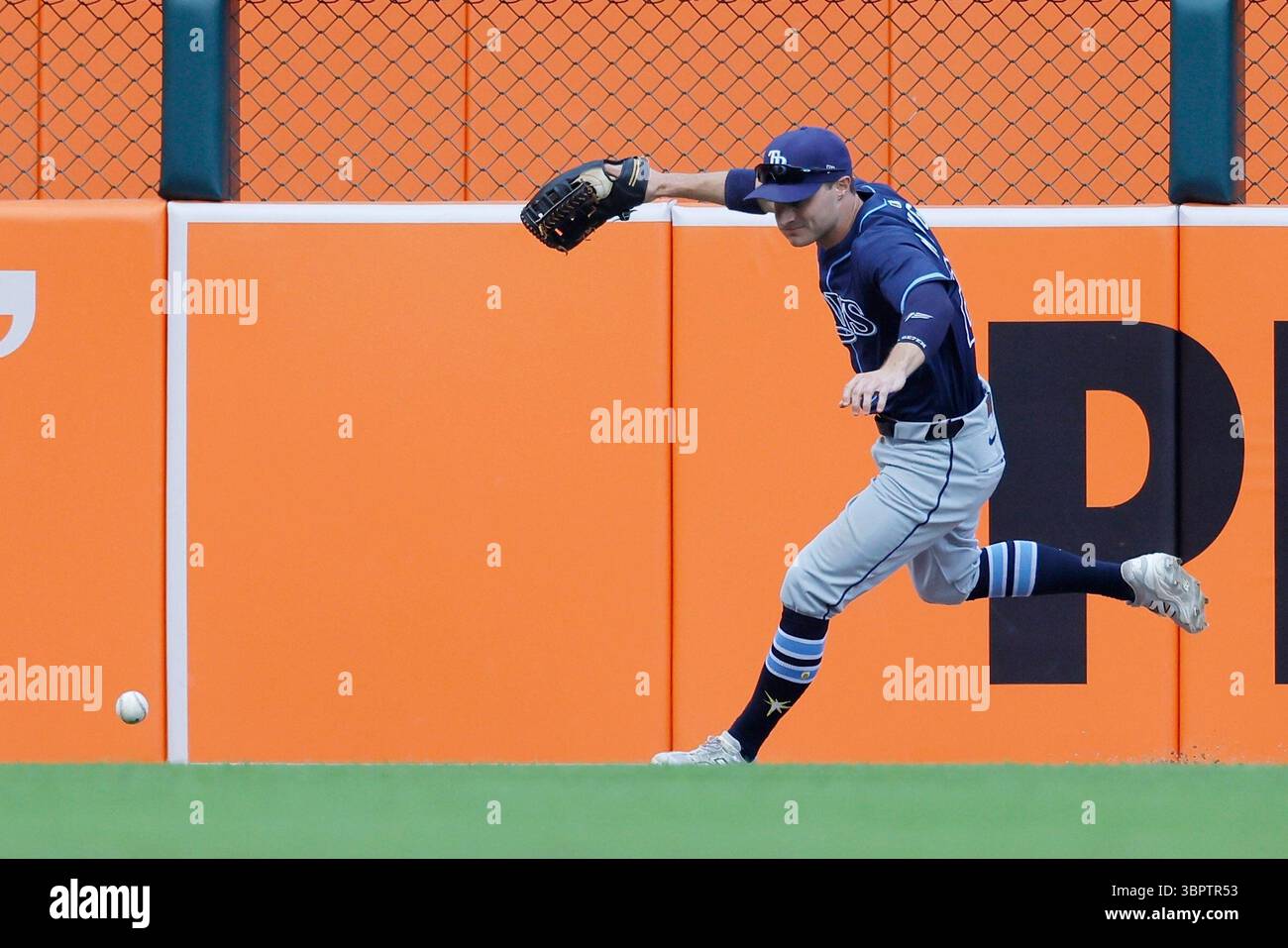 Tampa Bay Rays left fielder Jake Mangum chases down a double hit by ...