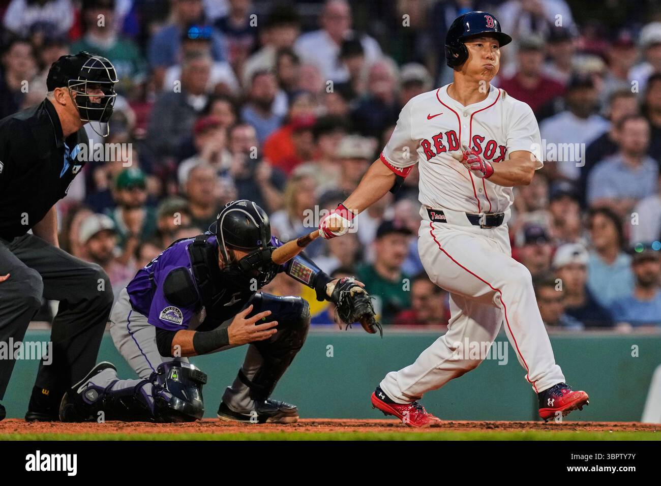 Boston Red Sox designated hitter Masataka Yoshida watches his RBI single during the fourth ...