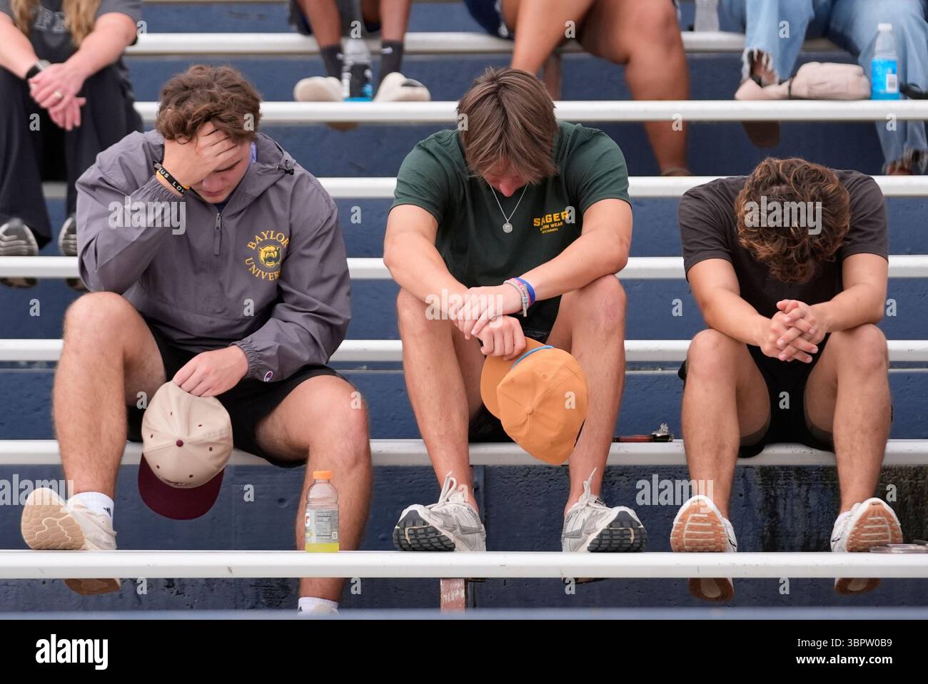 Attendees react during a vigil for flooding victims at Tivy Antler ...