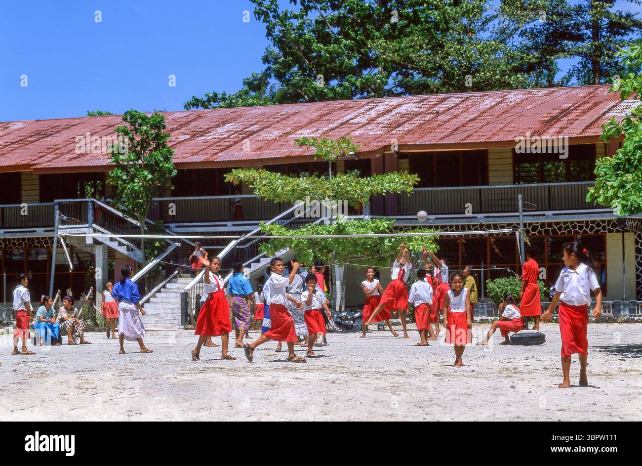 Samoan school children playing volleyball in school playground, Upolu ...