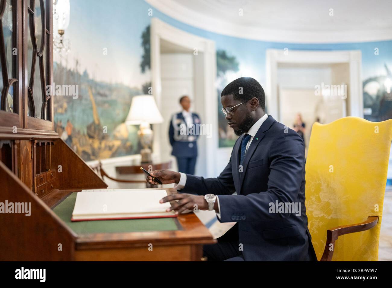President Bassirou Diomaye Faye of Senegal signs the guest book in the ...