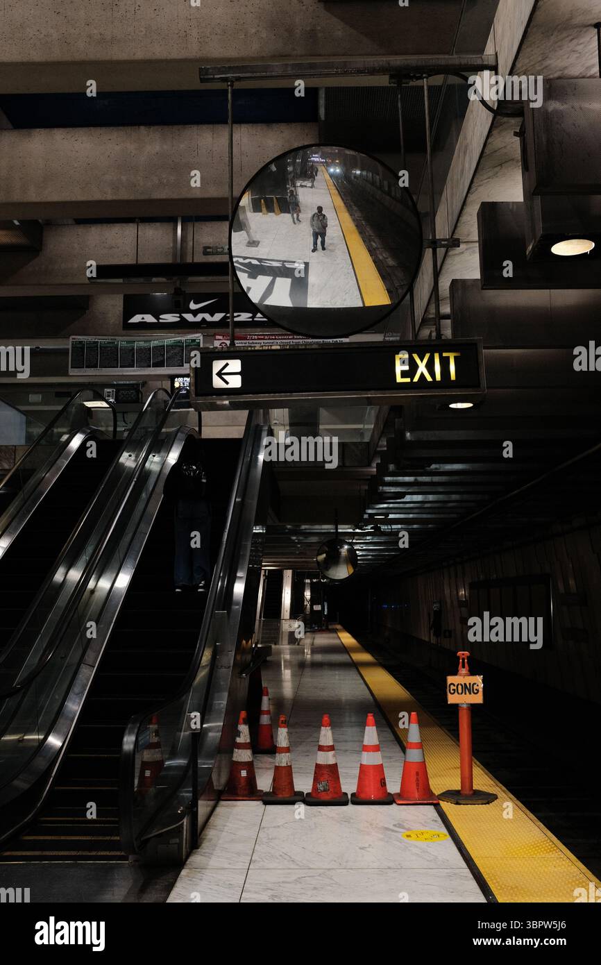 Traffic Cones sit next to an escalator at an underground Muni train ...