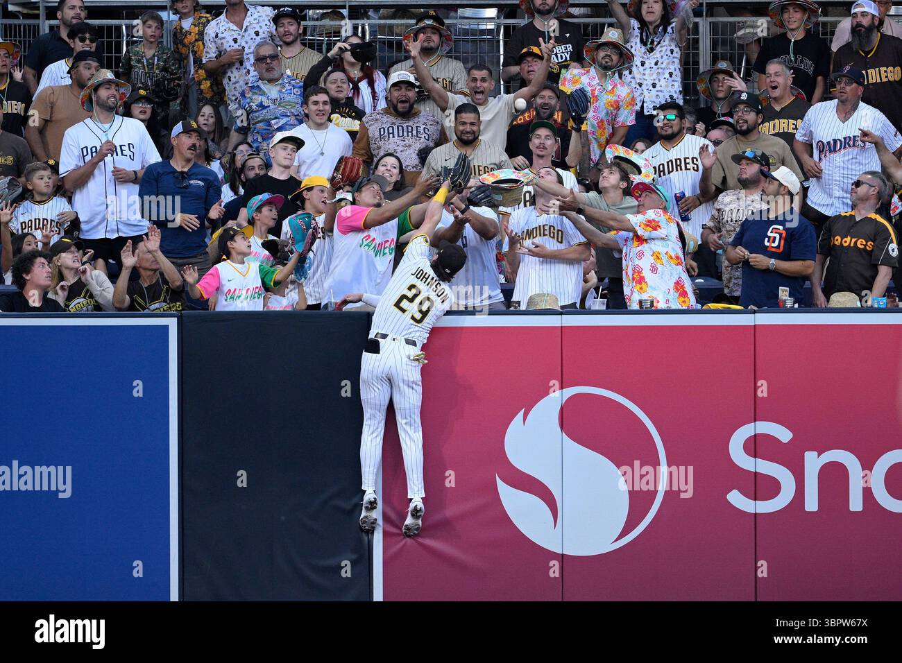 San Diego Padres left fielder Bryce Johnson (29) cannot make a catch on ...