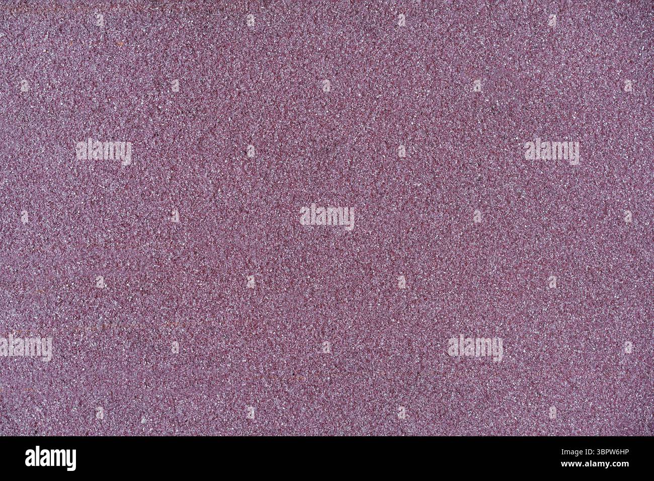 Macro view of a rough purple textured surface. Granular and speckled ...