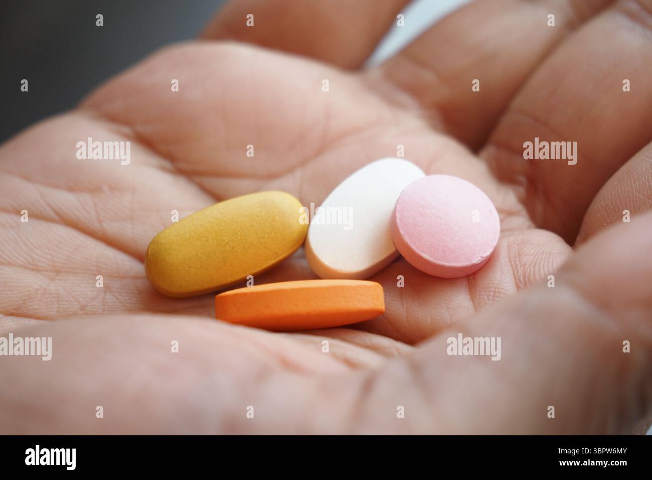 Hand holding various tablets hi-res stock photography and images - Alamy