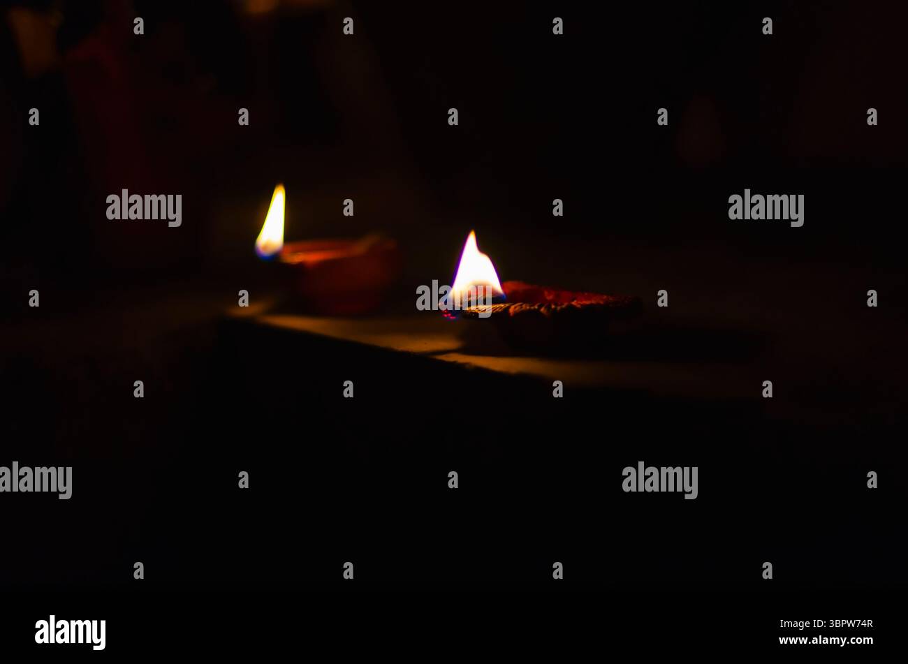 Diwali celebration oil lamps glowing hi-res stock photography and ...