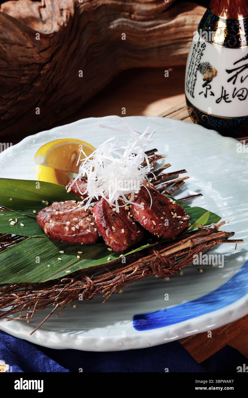 Salt Grilled beef tongue,Japanese food Stock Photo - Alamy
