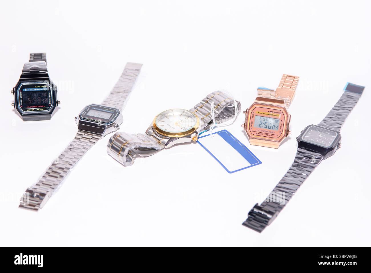 Different watches with electronic dial on white background. Electronic ...