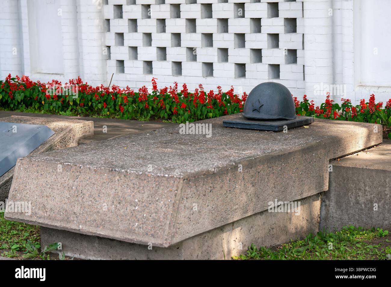 Helmet with a five pointed star on a granite slab. Monument to the ...