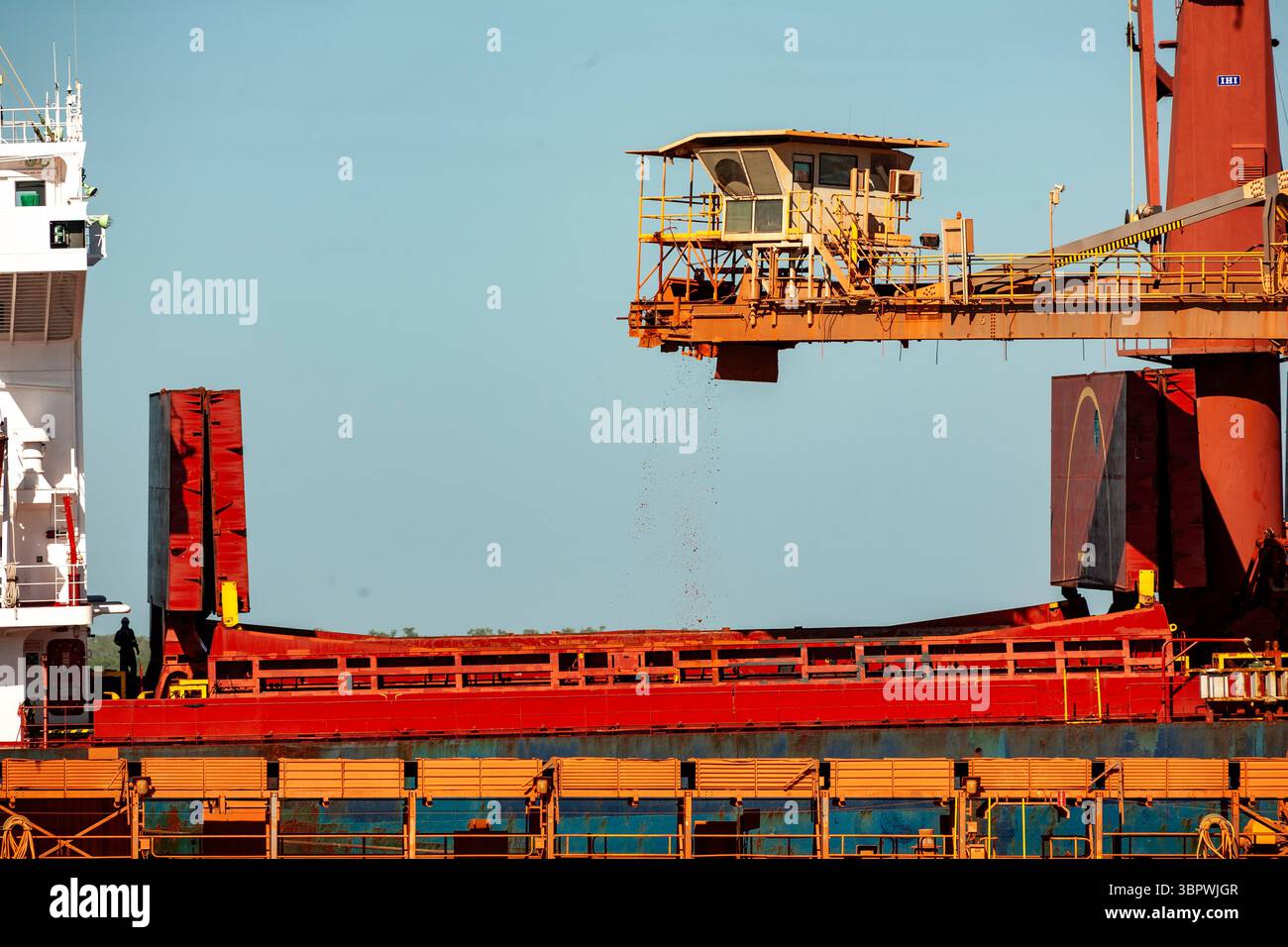 rio tinto bauxite starting to load cargo falling into ship hull ...