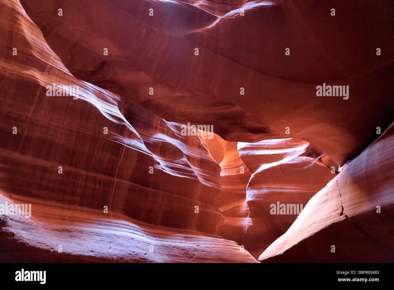 Soft light reveals the smooth curves of Antelope Canyon's sandstone ...