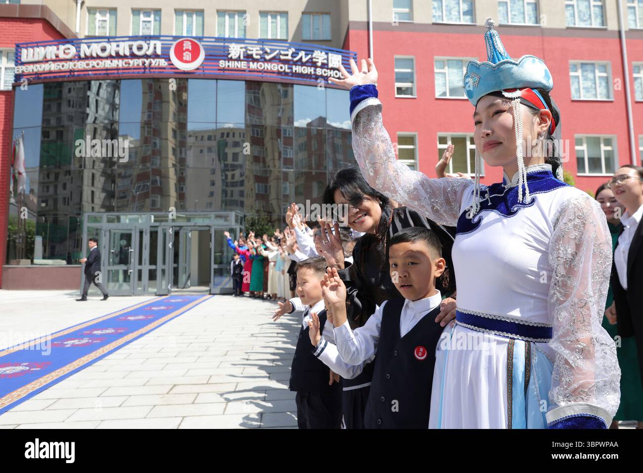Students see off Japan's Emperor Naruhito at the Shine Mongol School in Ulaanbaatar, Mongolia ...