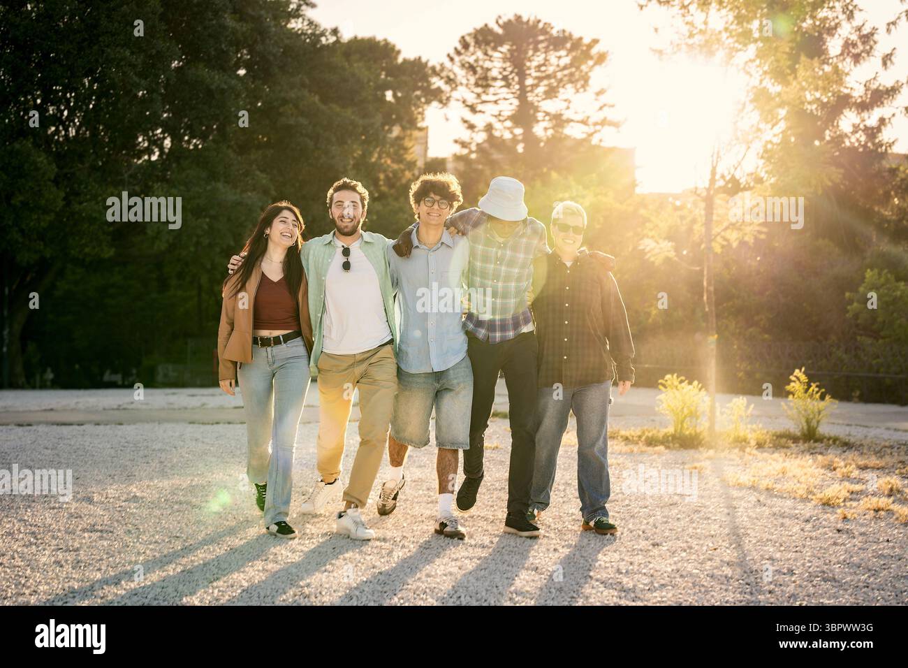 A diverse multiethnic group of friends with their arms around each ...